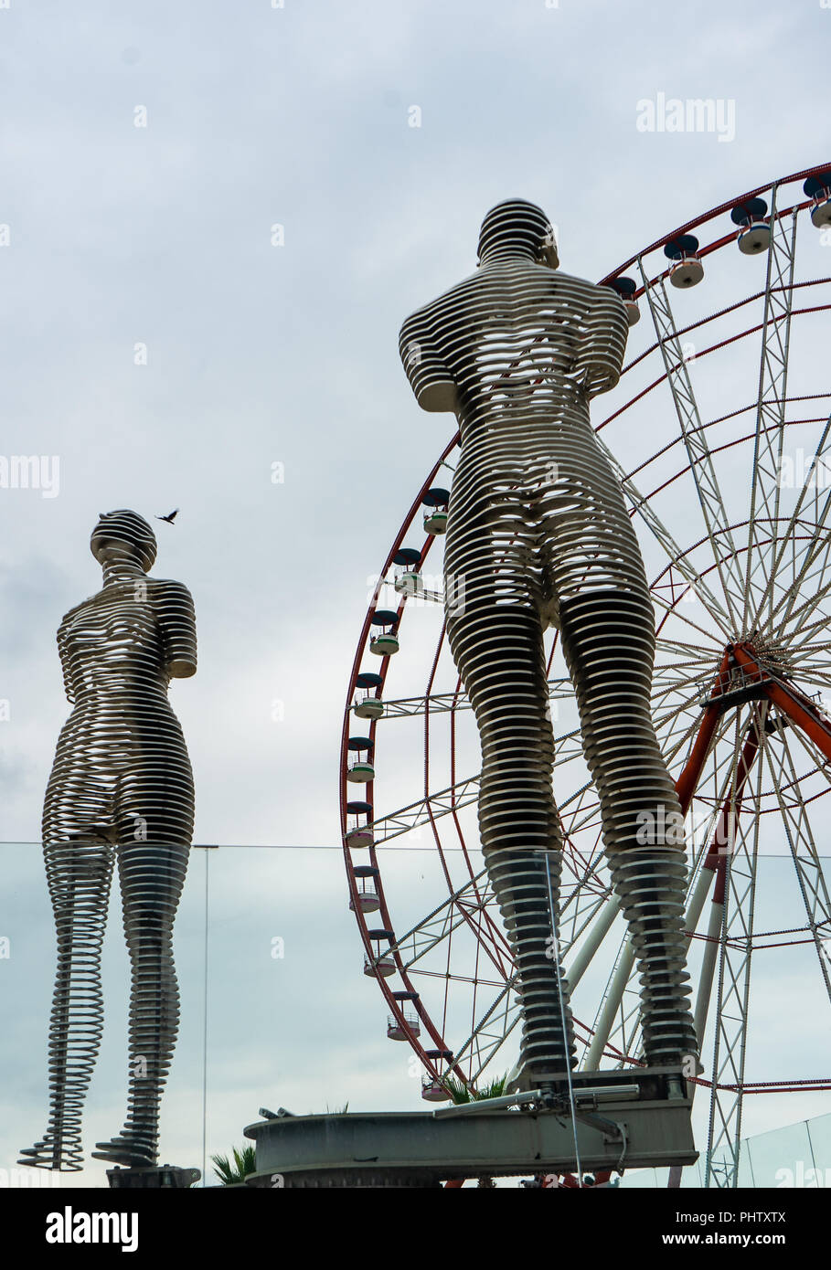 Batumi, Georgia / July 10, 2018: Ferris wheel and moving statues Nino ...