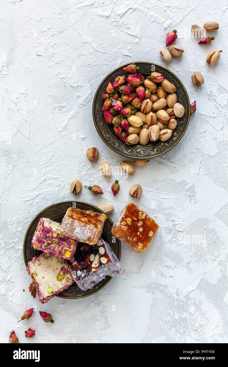 Turkish delight, pistachio and small dry roses Stock Photo - Alamy