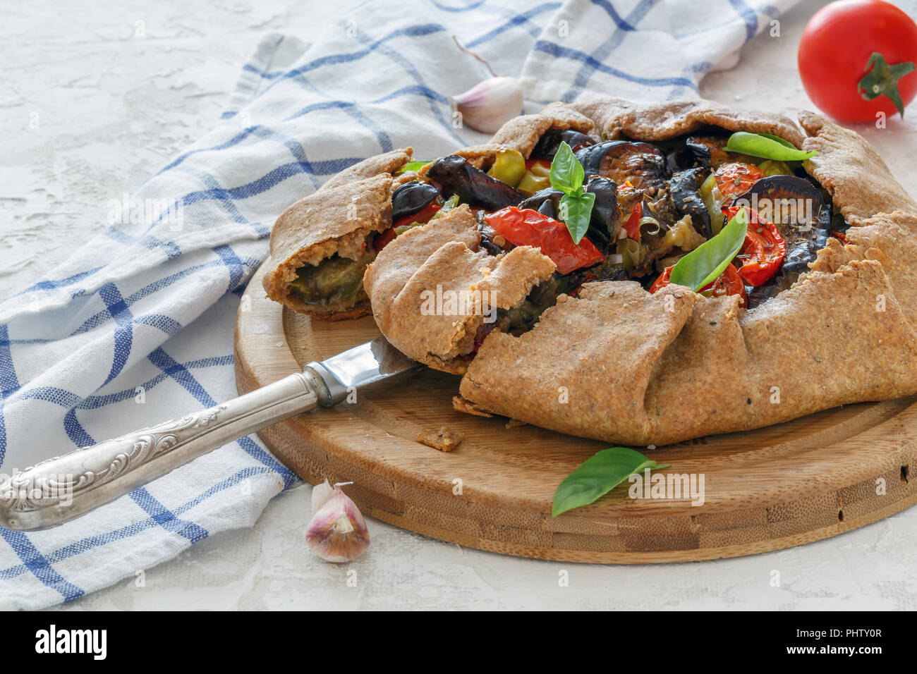 Cut free-form pie with vegetables Stock Photo - Alamy