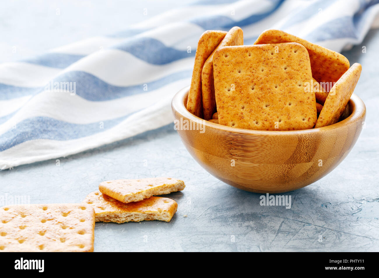 Crackers with bran in a wooden bowl Stock Photo - Alamy