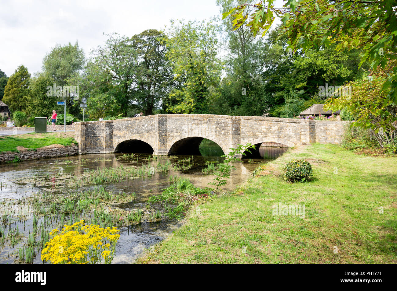 Stone bridge across River Coln, The Street, Bibury, Gloucestershire ...