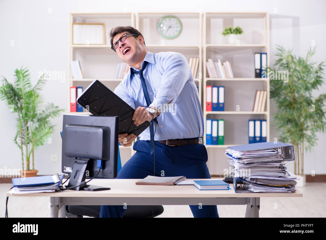 Angry businessman frustrated with too much work Stock Photo - Alamy