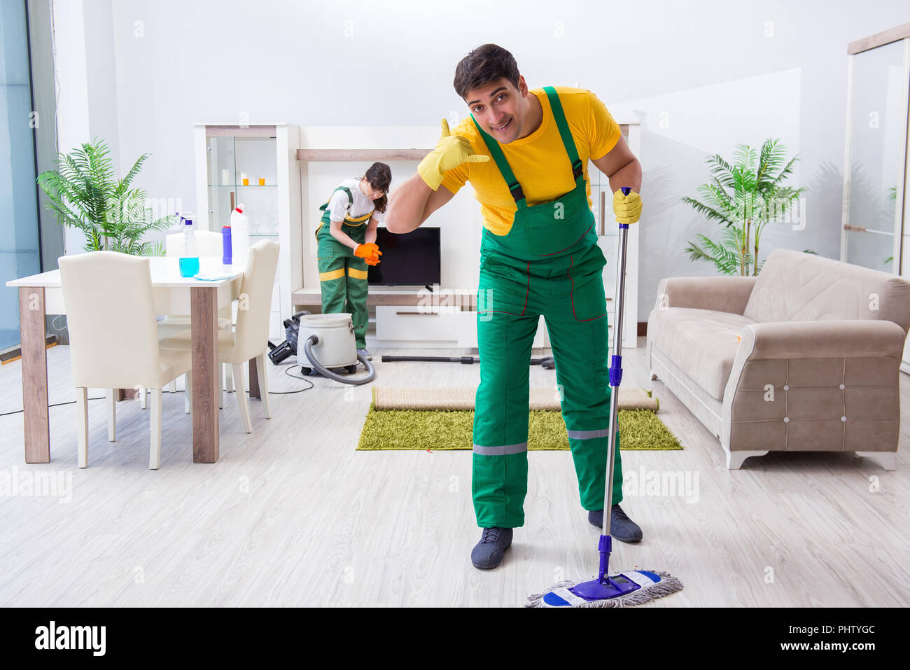 Cleaning professional contractors working at house Stock Photo - Alamy