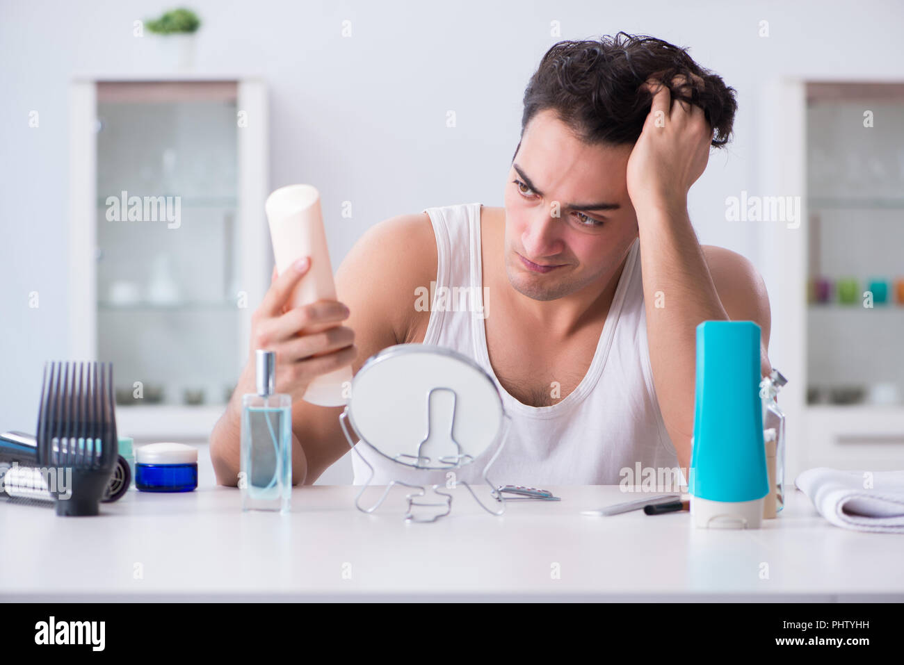 Man staring at reflection in mirror hi-res stock photography and images ...