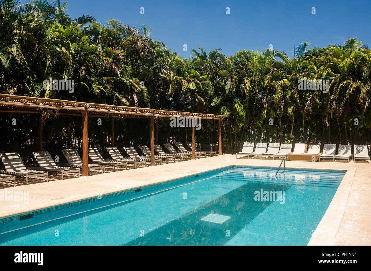 VIP swimming pool area of a mexican caribbean resort Stock Photo - Alamy