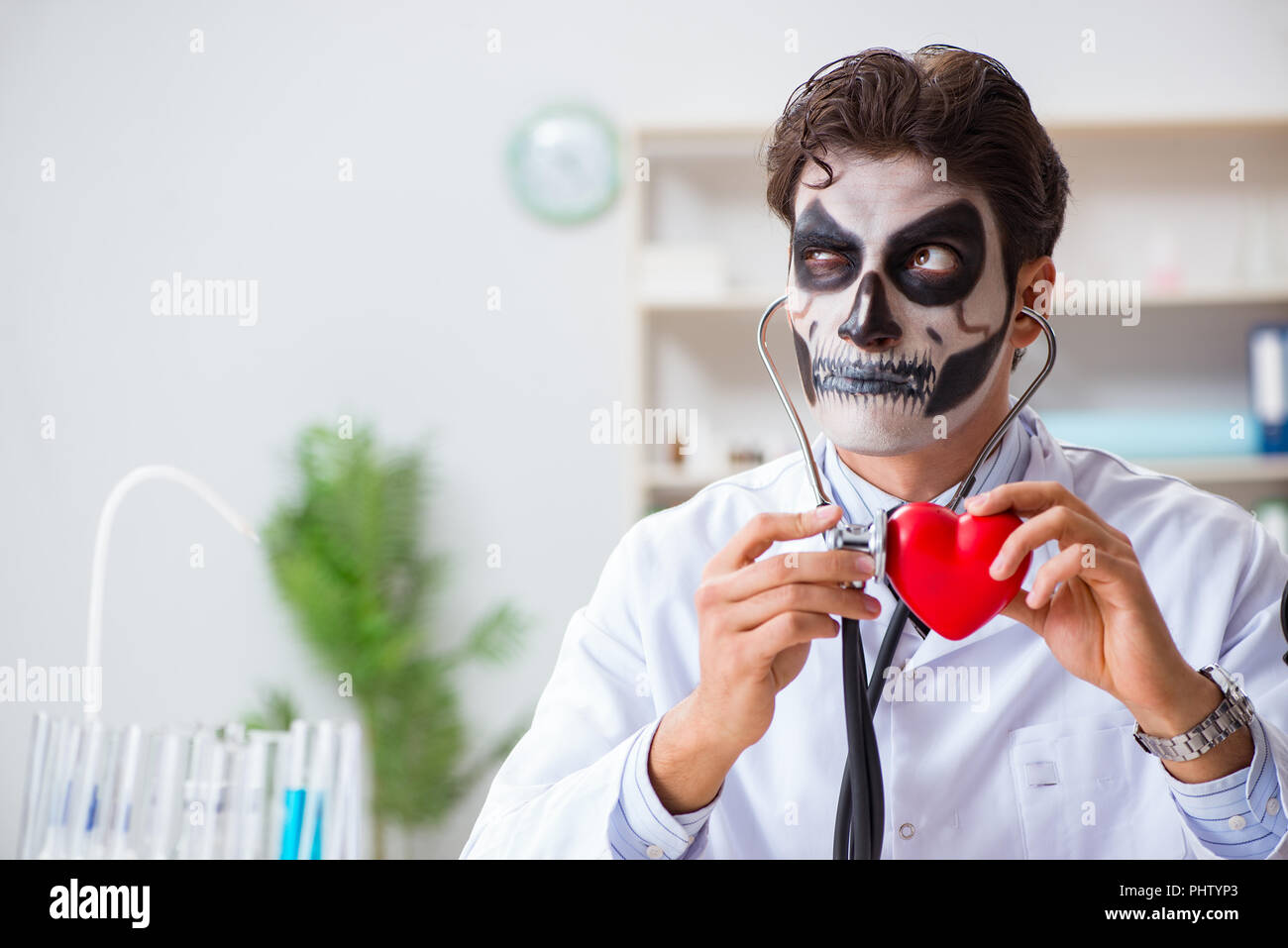 Scary monster doctor working in lab Stock Photo - Alamy
