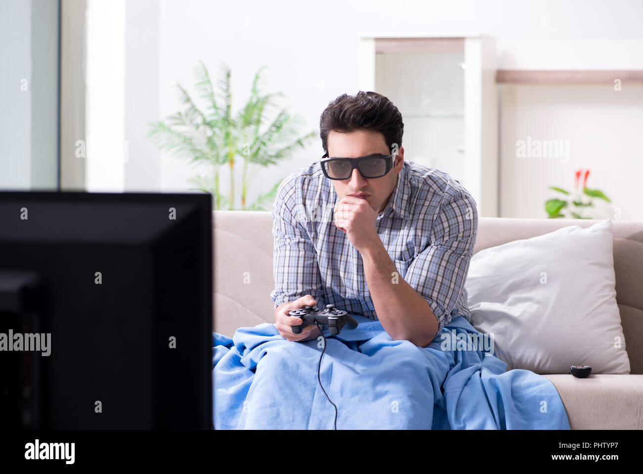 Man playing 3d games at home Stock Photo - Alamy