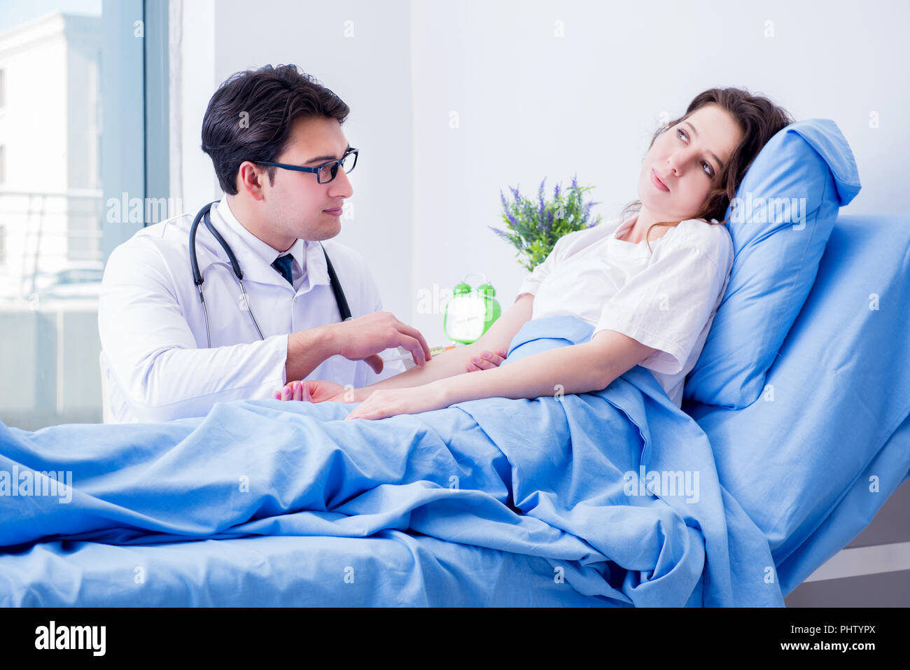 Doctor doing medical injection in hospital room Stock Photo - Alamy