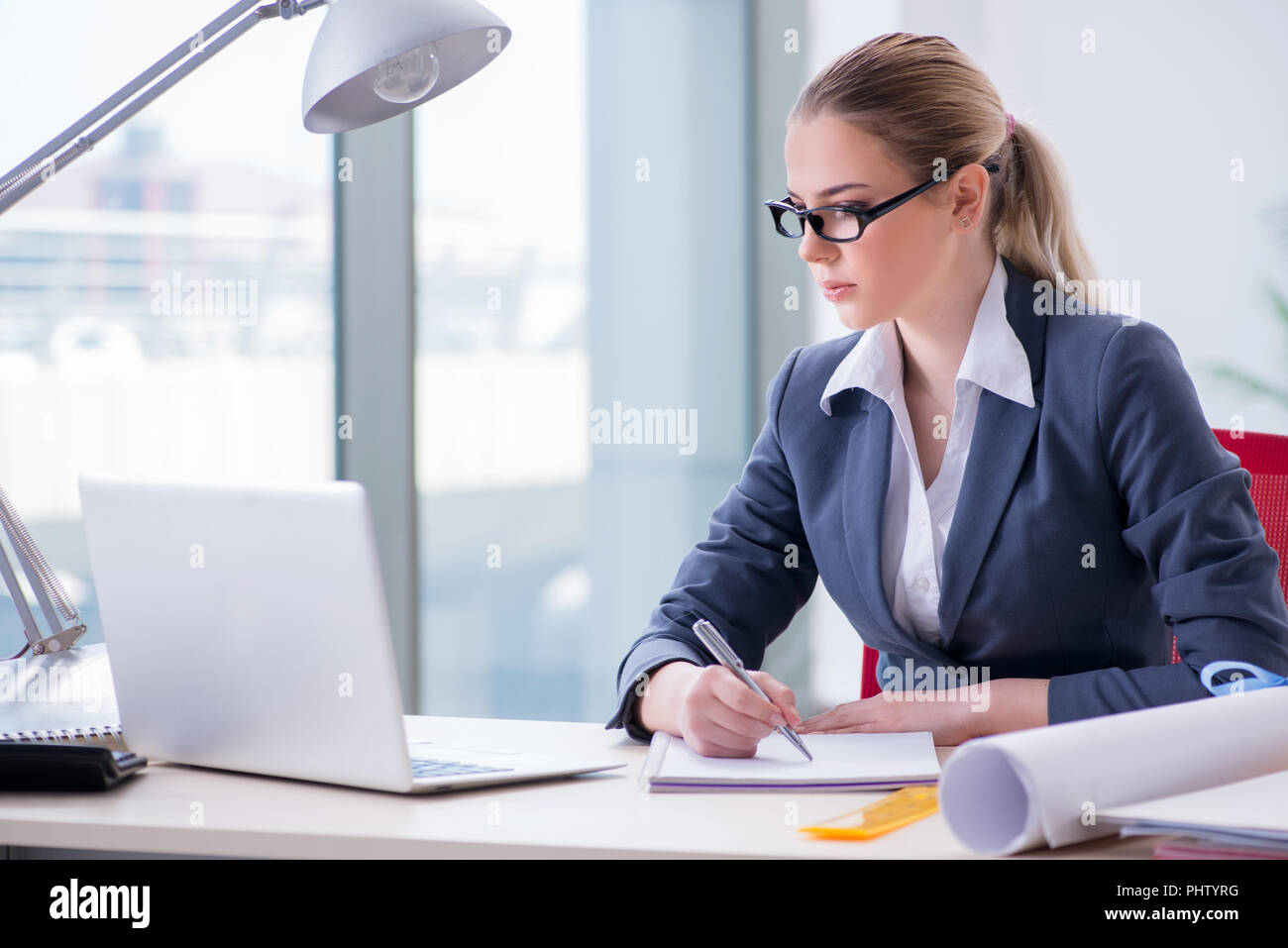 Woman architect working on the project Stock Photo - Alamy