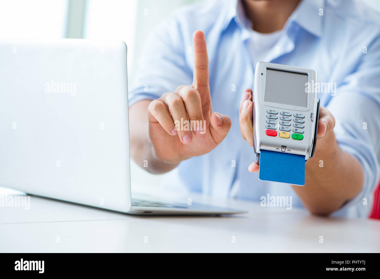 Man processing credit card transaction with POS terminal Stock Photo ...