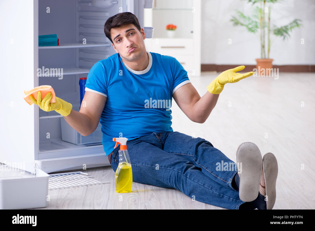 Man cleaning fridge in hygiene concept Stock Photo - Alamy