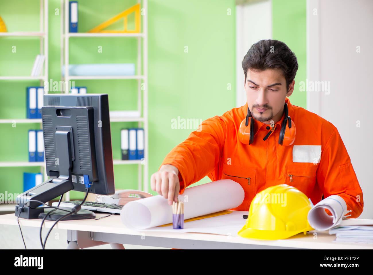 Construction supervisor planning new project in office Stock Photo - Alamy