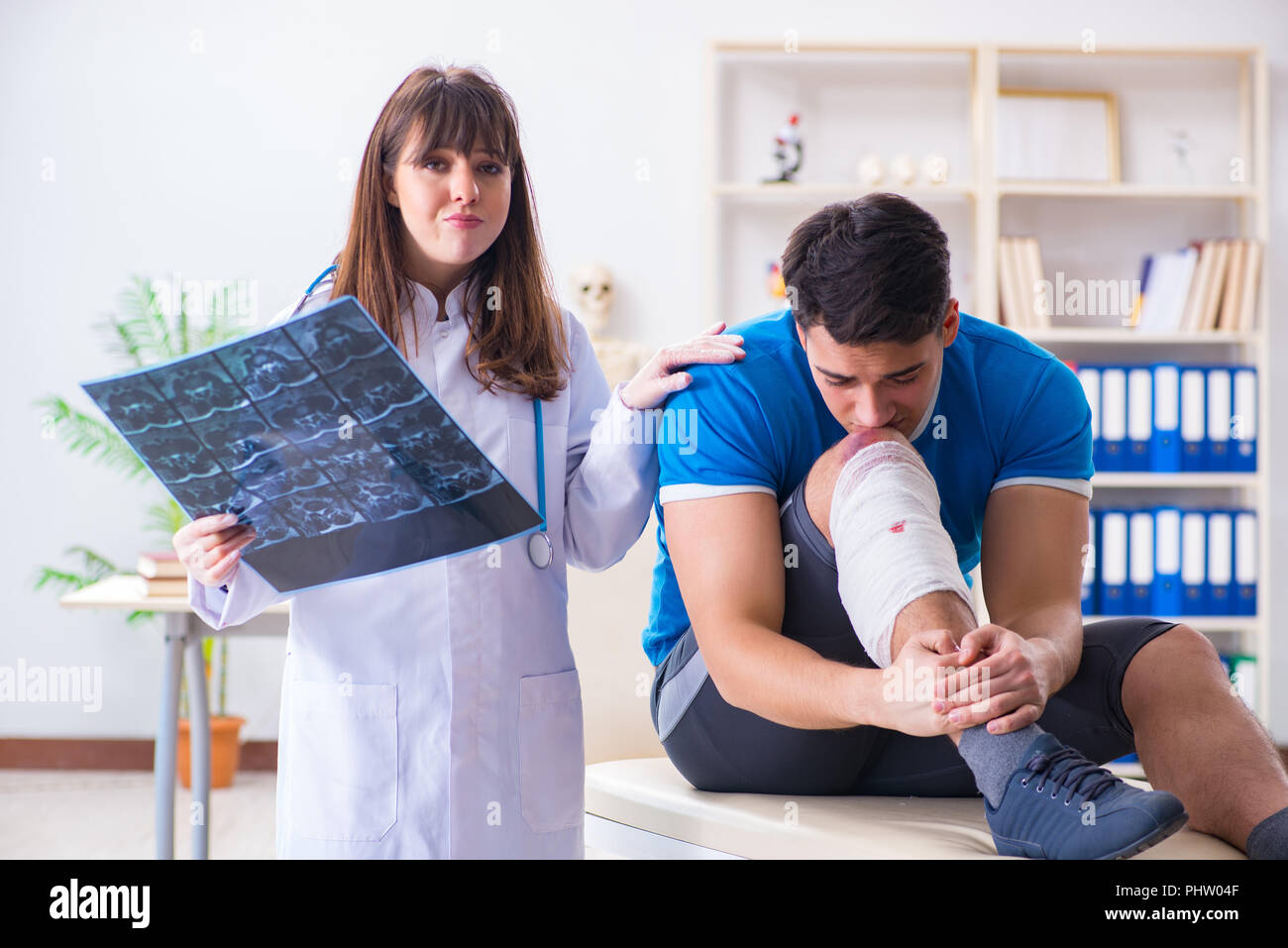 Sports player visiting doctor after injury Stock Photo - Alamy