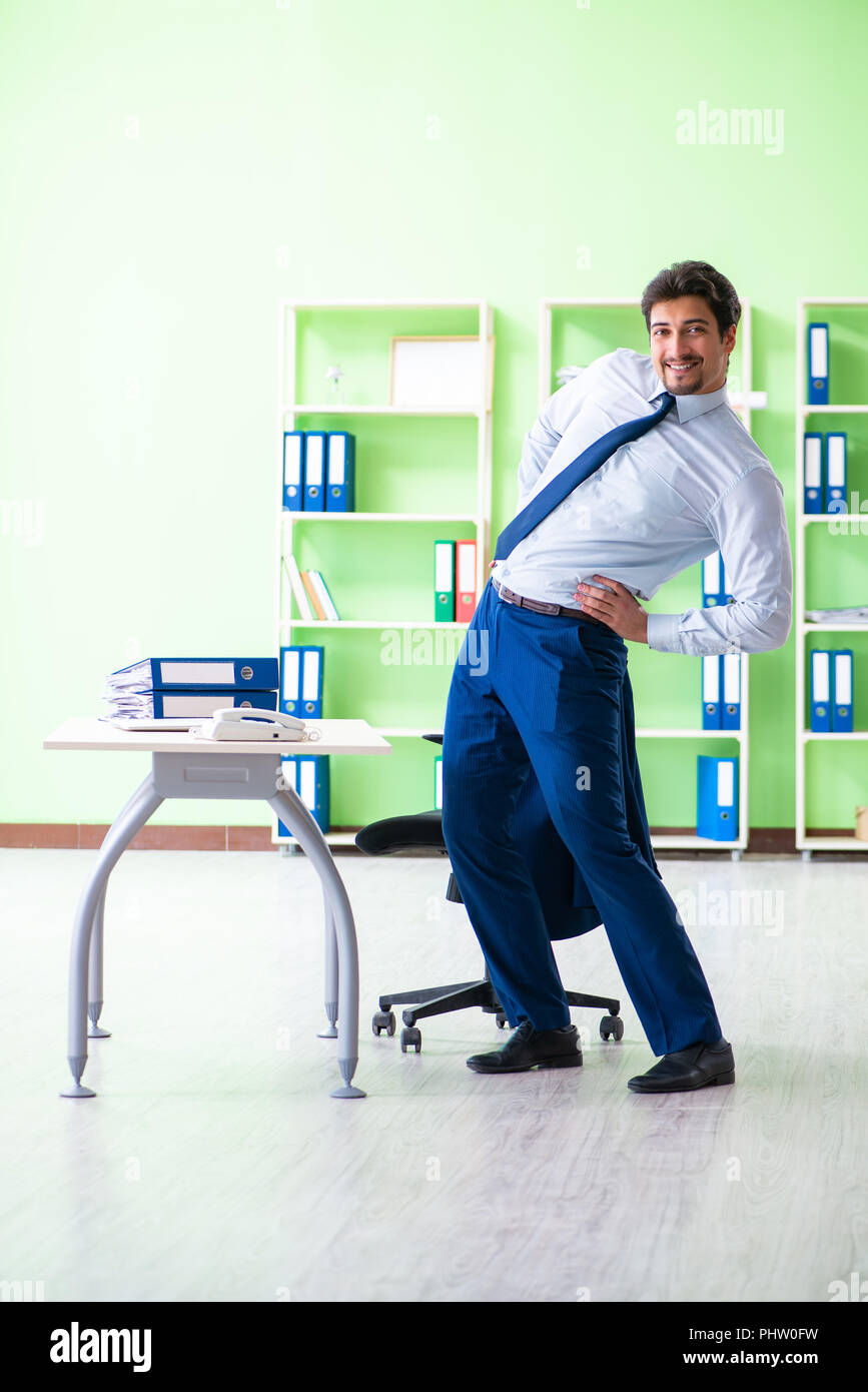 Employee doing exercises during break at work Stock Photo - Alamy