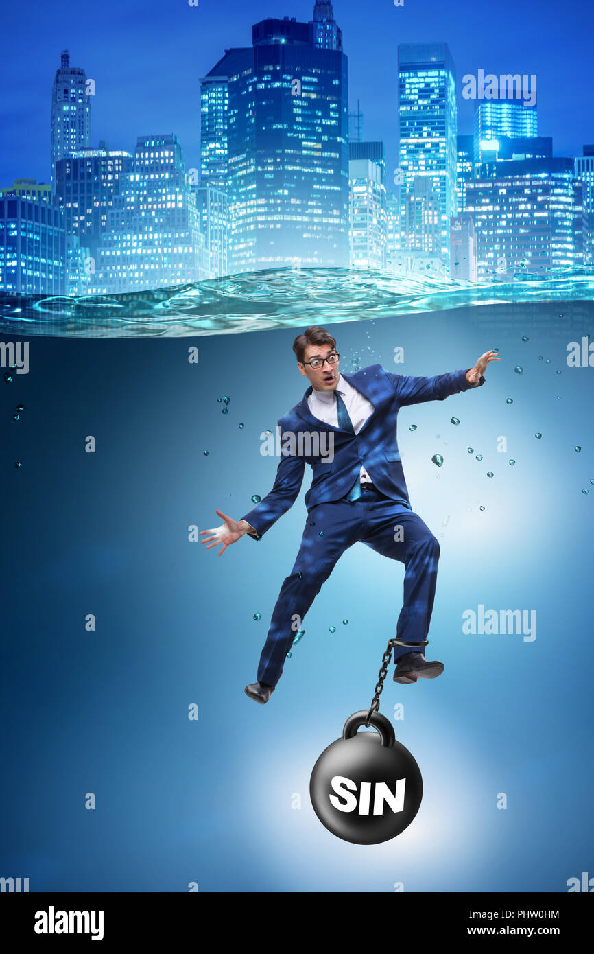 Businessman drowning under the burden of sin and guilt Stock Photo - Alamy