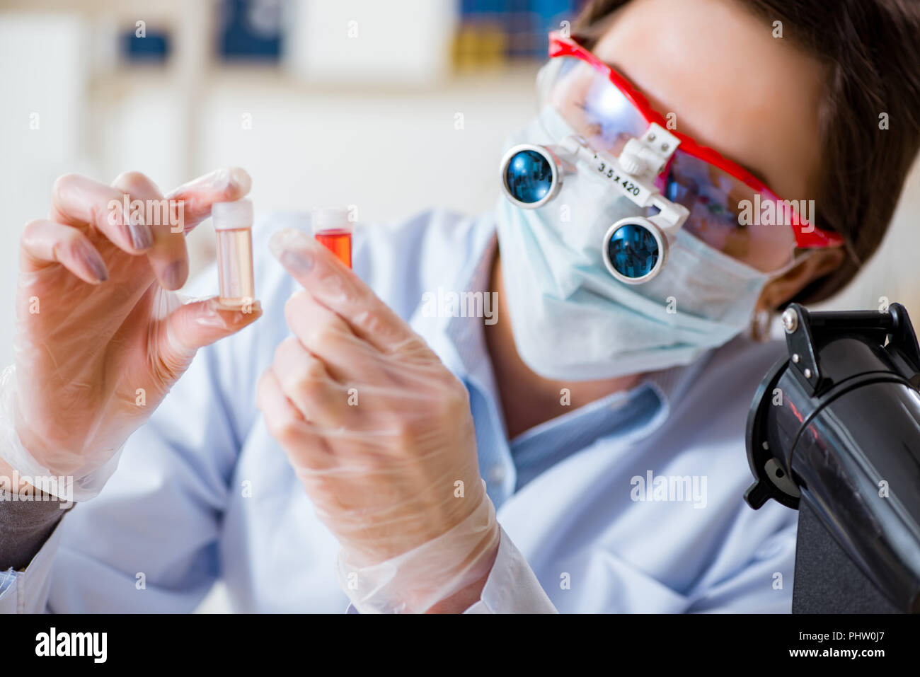 Lab assistant in drug synthesis concept Stock Photo - Alamy