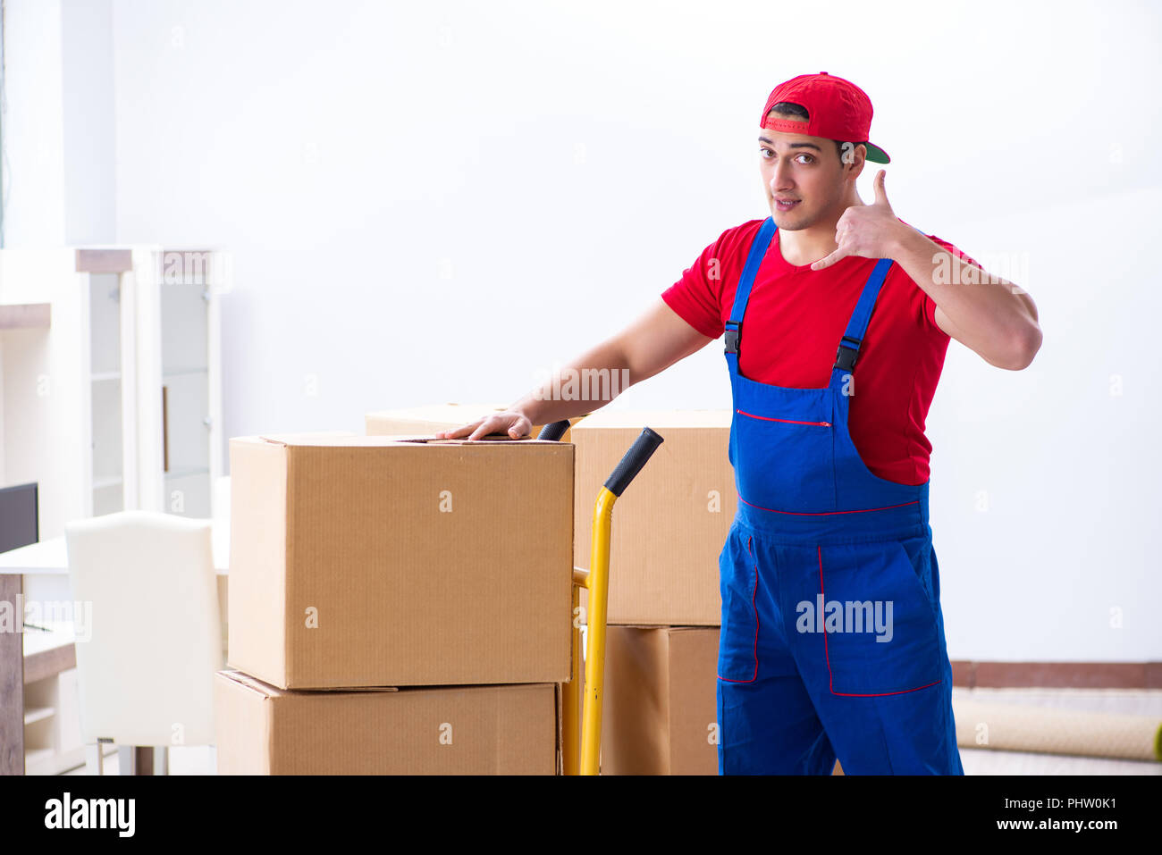 Contractor worker moving boxes during office move Stock Photo - Alamy