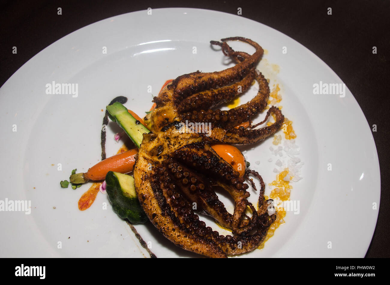 Seafood at an expensive restaurant: Grilled Octopus Stock Photo - Alamy
