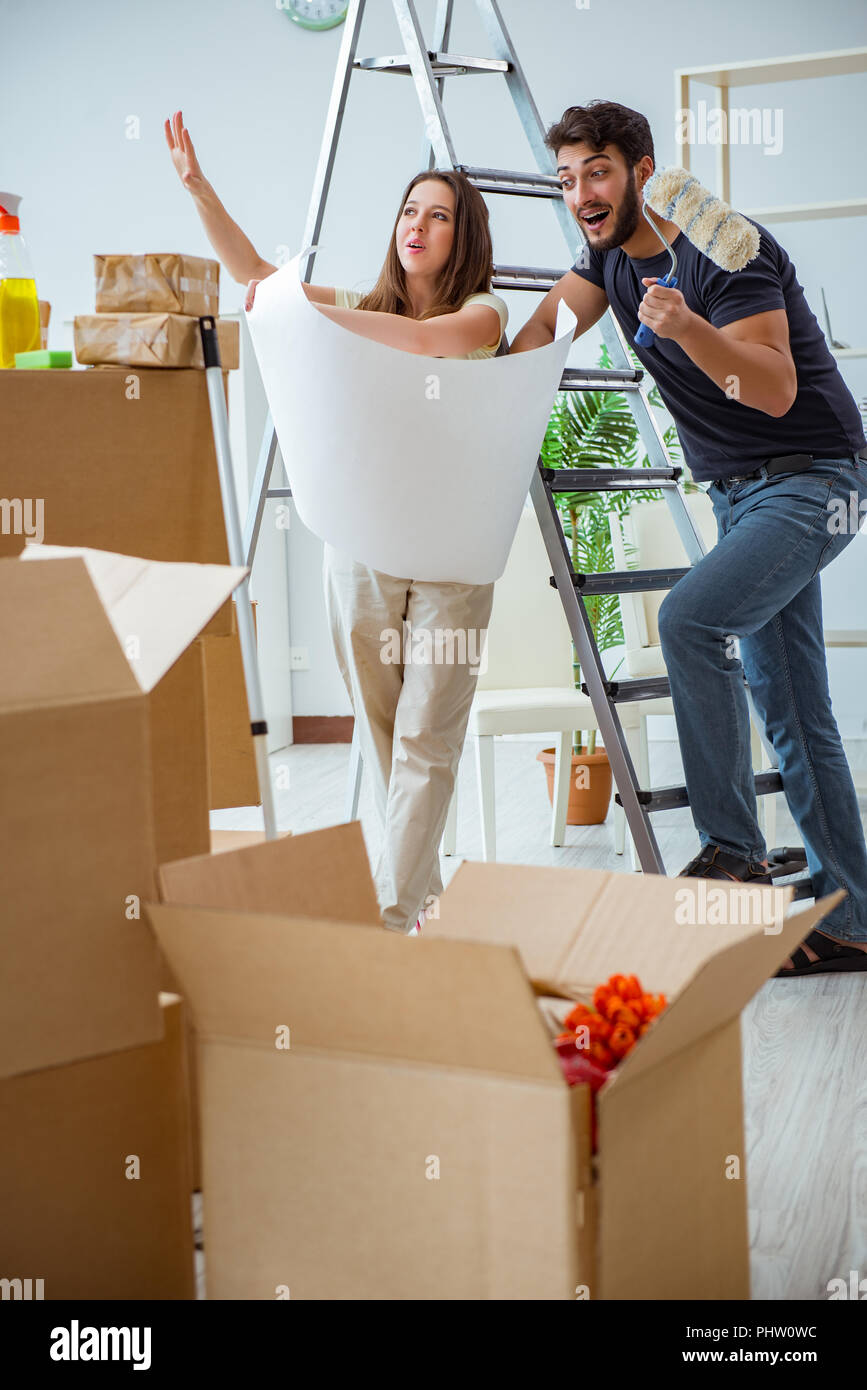 Young family unpacking at new house with boxes Stock Photo - Alamy