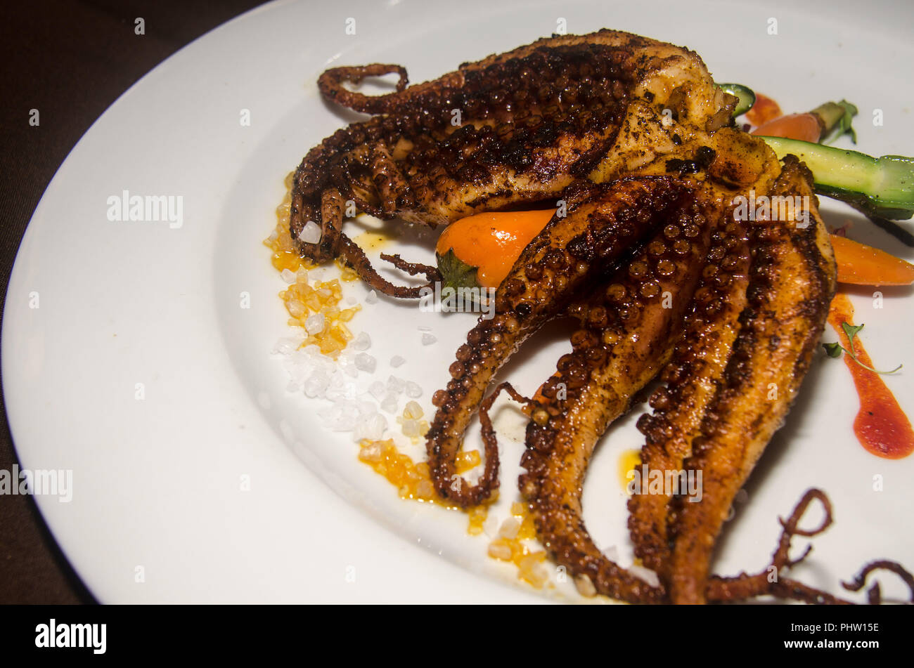 Seafood at an expensive restaurant: Grilled Octopus Stock Photo - Alamy