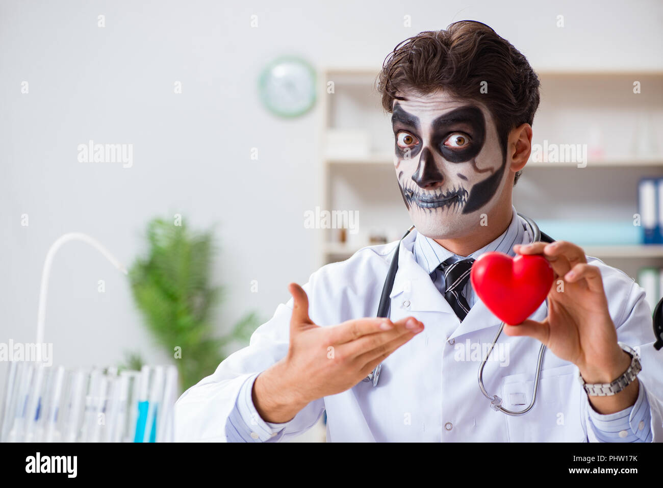 Scary monster doctor working in lab Stock Photo - Alamy