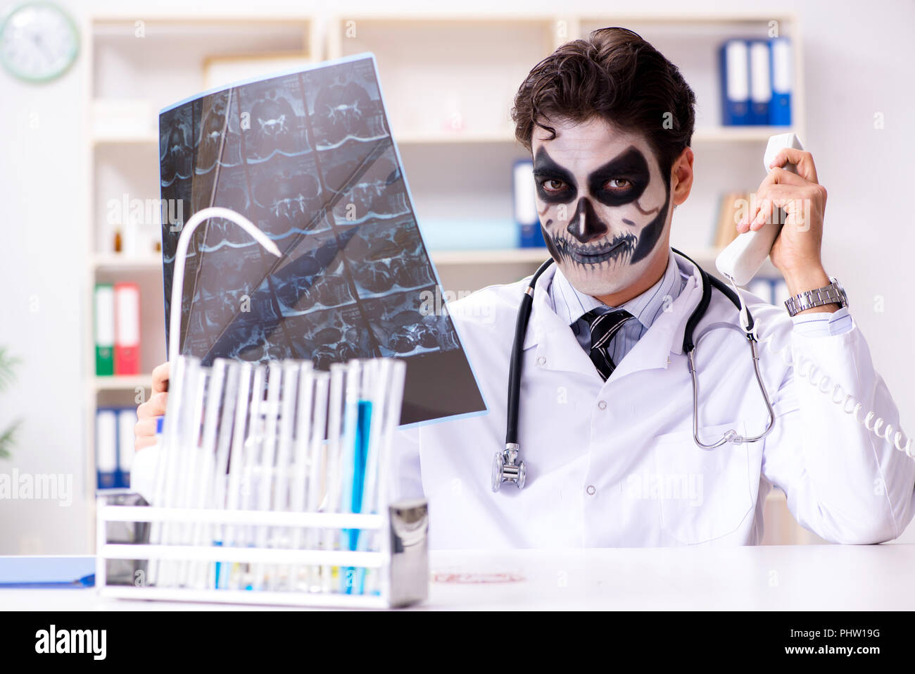 Scary monster doctor working in lab Stock Photo - Alamy