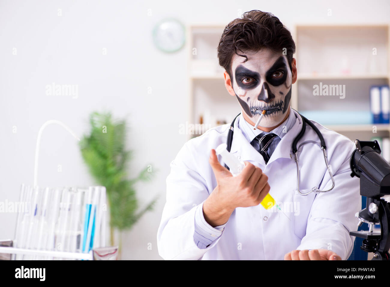 Scary monster doctor working in lab Stock Photo - Alamy