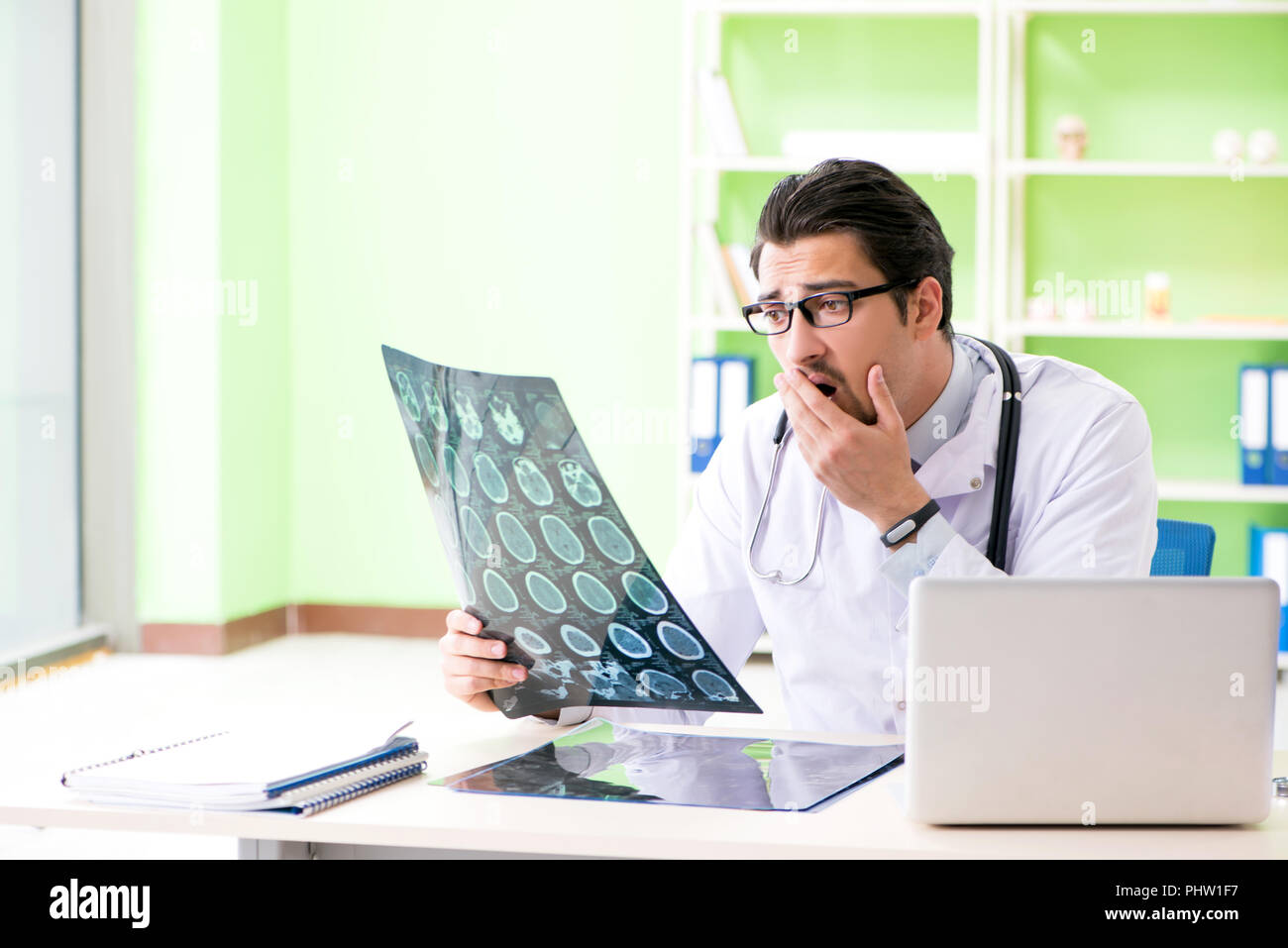 Doctor radiologist looking at x-ray scan in hospital Stock Photo - Alamy