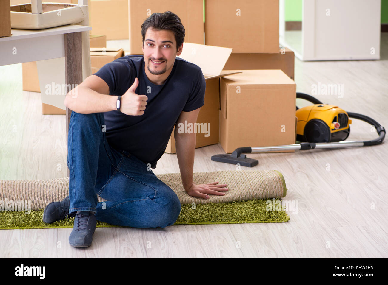 Man moving house with boxes Stock Photo - Alamy
