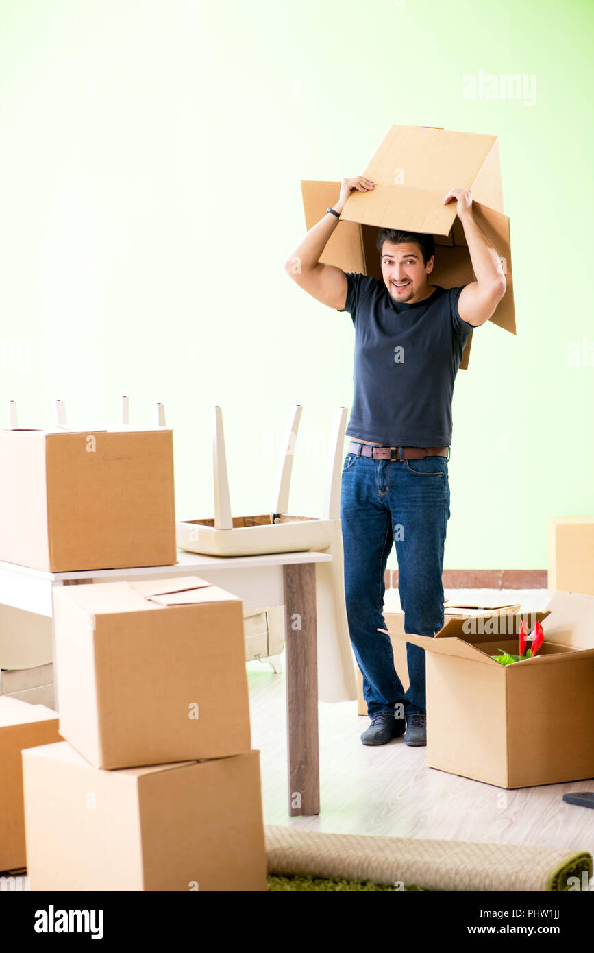 Man moving house with boxes Stock Photo - Alamy