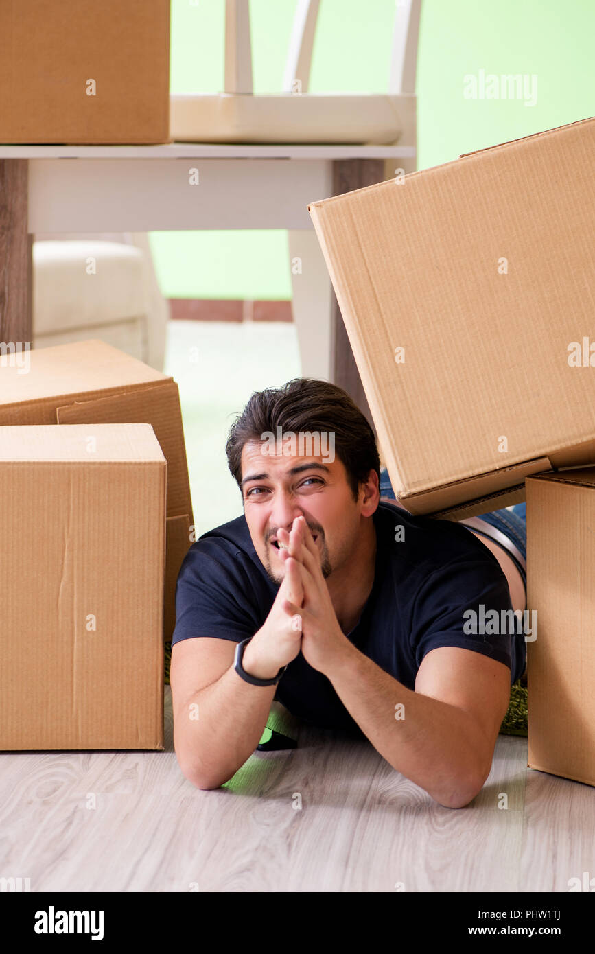 Man moving house with boxes Stock Photo - Alamy