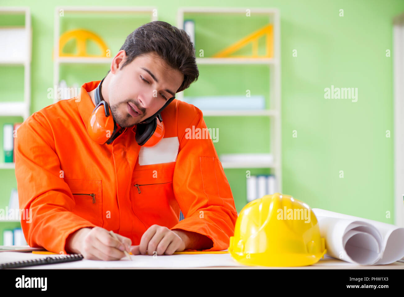 Construction supervisor planning new project in office Stock Photo - Alamy