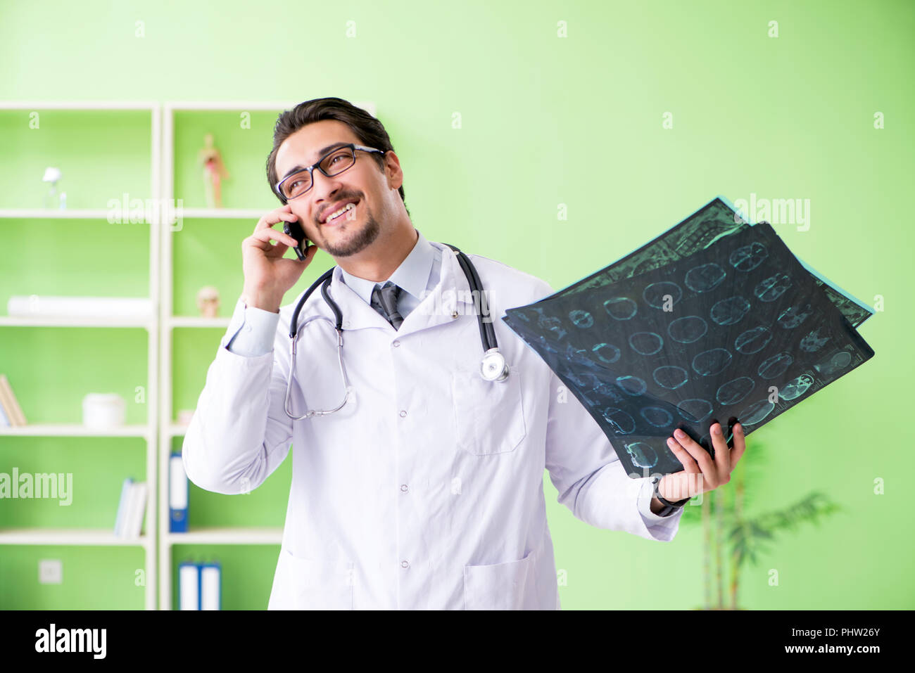 Doctor radiologist looking at x-ray scan in hospital Stock Photo - Alamy