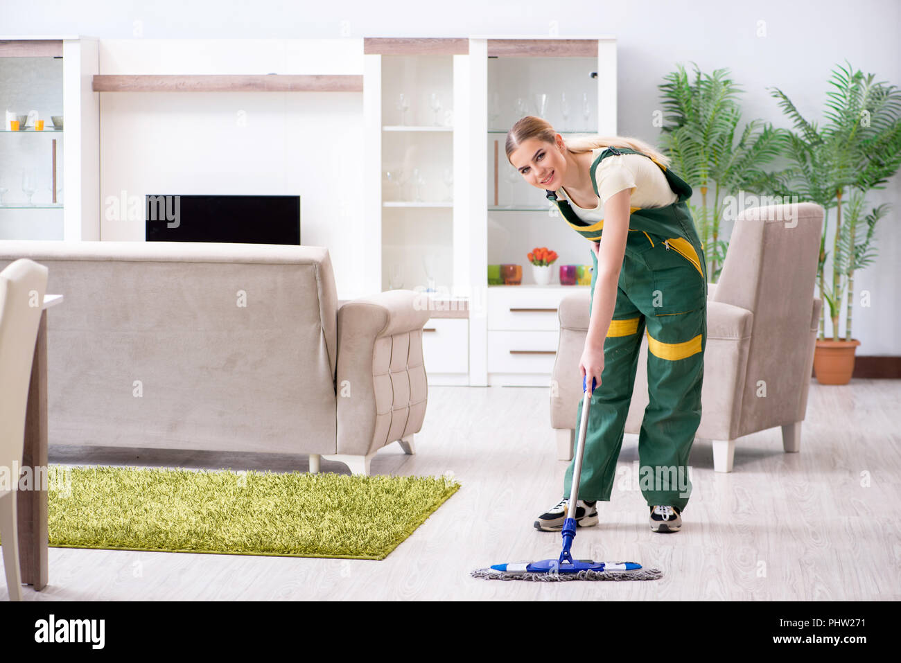 Woman female cleaner cleaning floor Stock Photo - Alamy