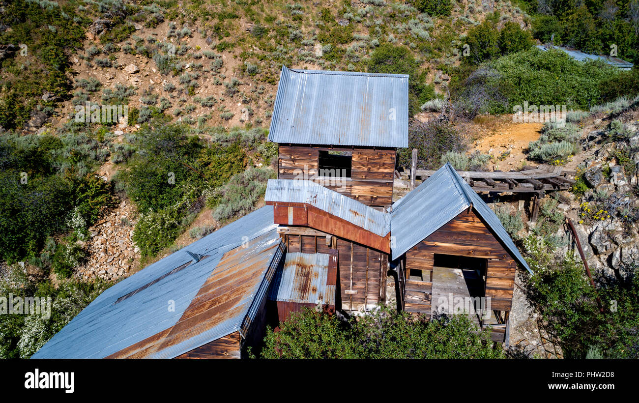 Wood buildings and tin roofs make up what is left of an abandoned gold ...