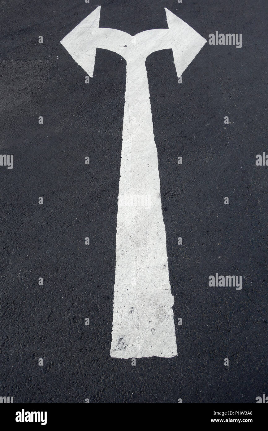 Two choices arrow splits in two, go both ways Stock Photo - Alamy