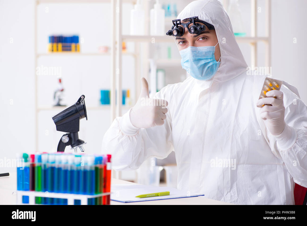 Drug synthesis concept with chemist working in research lab Stock Photo ...
