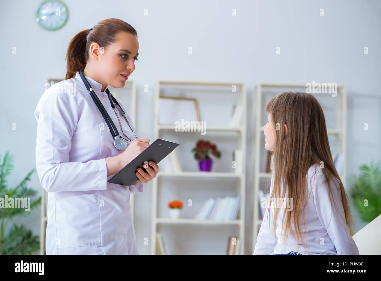 Female doctor pediatrician checking girl Stock Photo - Alamy