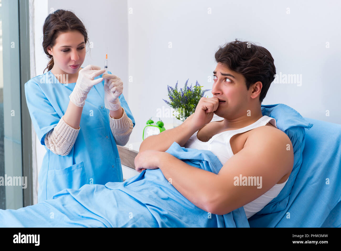 Doctor doing medical injection in hospital room Stock Photo - Alamy