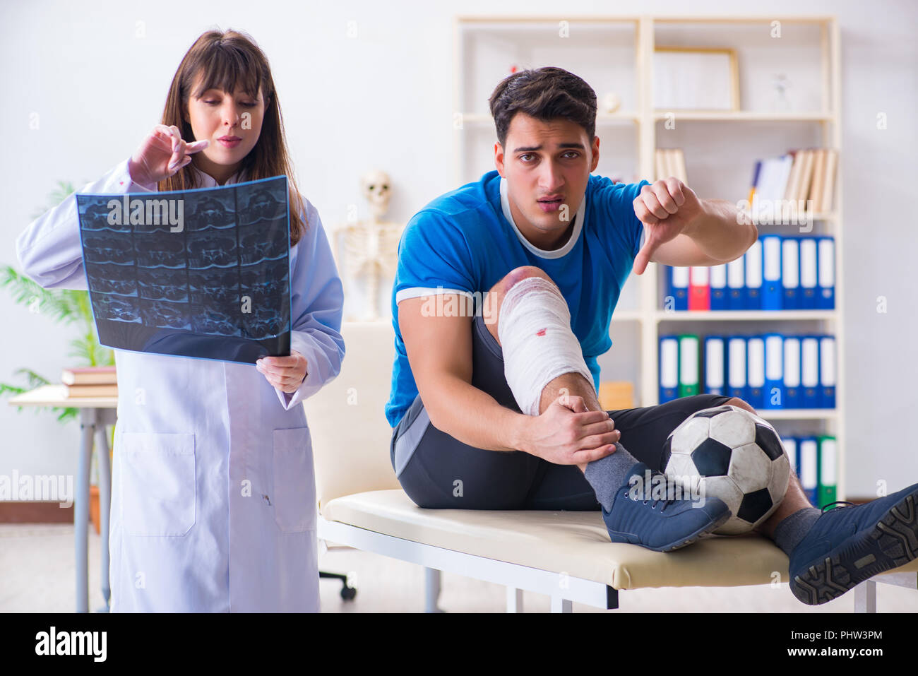 Football soccer player visiting doctor after injury Stock Photo - Alamy