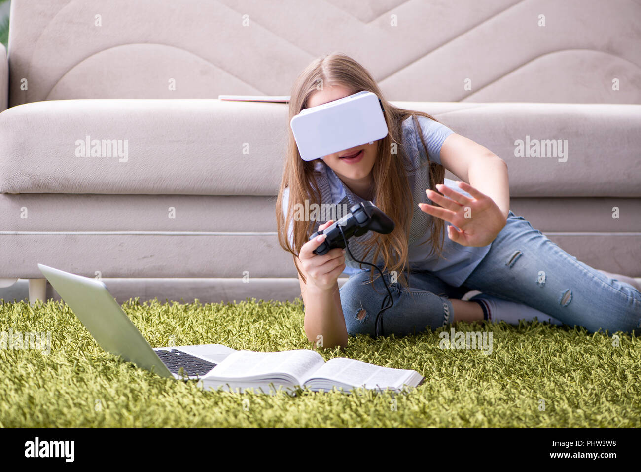 Young girl playing virtual reality games Stock Photo - Alamy