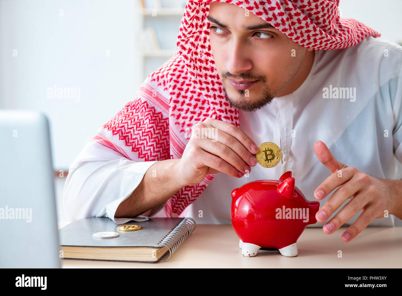 Arab man with bitcoin in cryptocurrency mining concept Stock Photo - Alamy