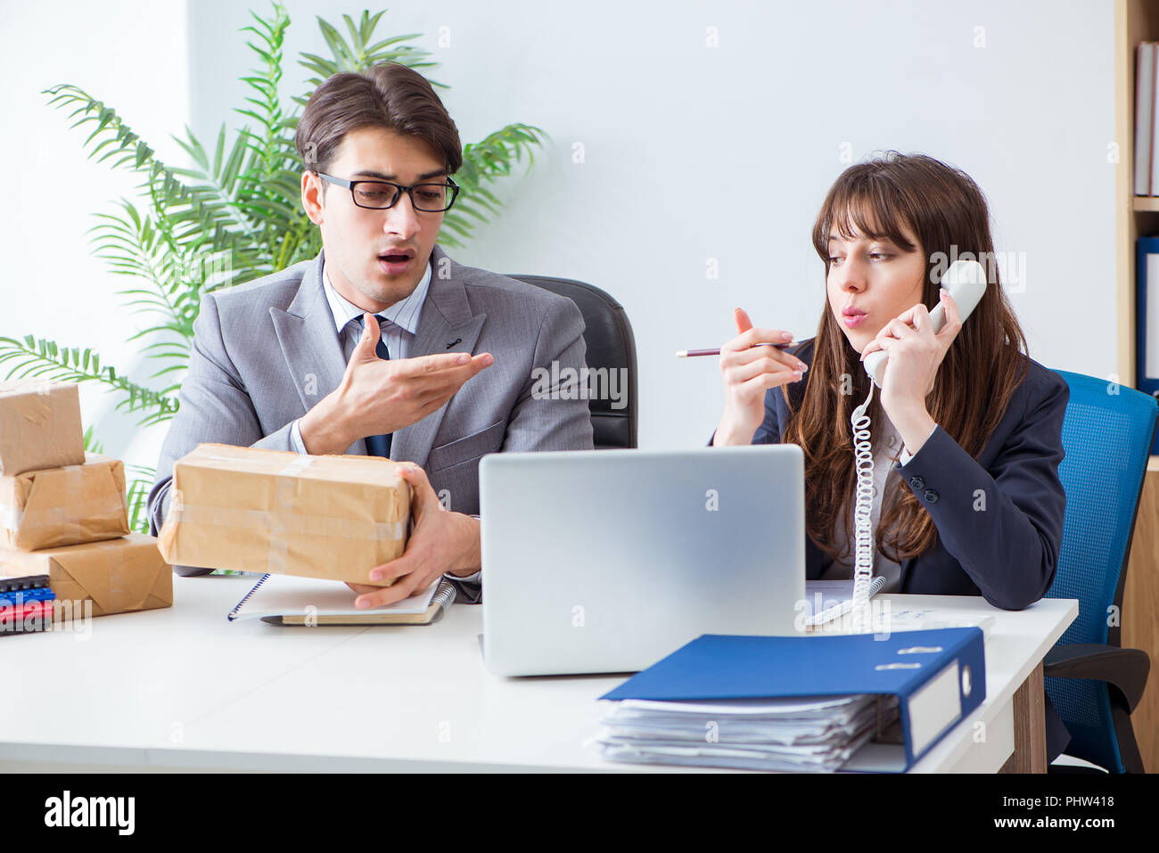 Business people receiving new mail and parcels Stock Photo - Alamy