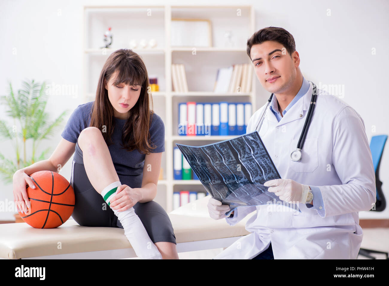 Female basketball player visiting doctor after injury Stock Photo - Alamy