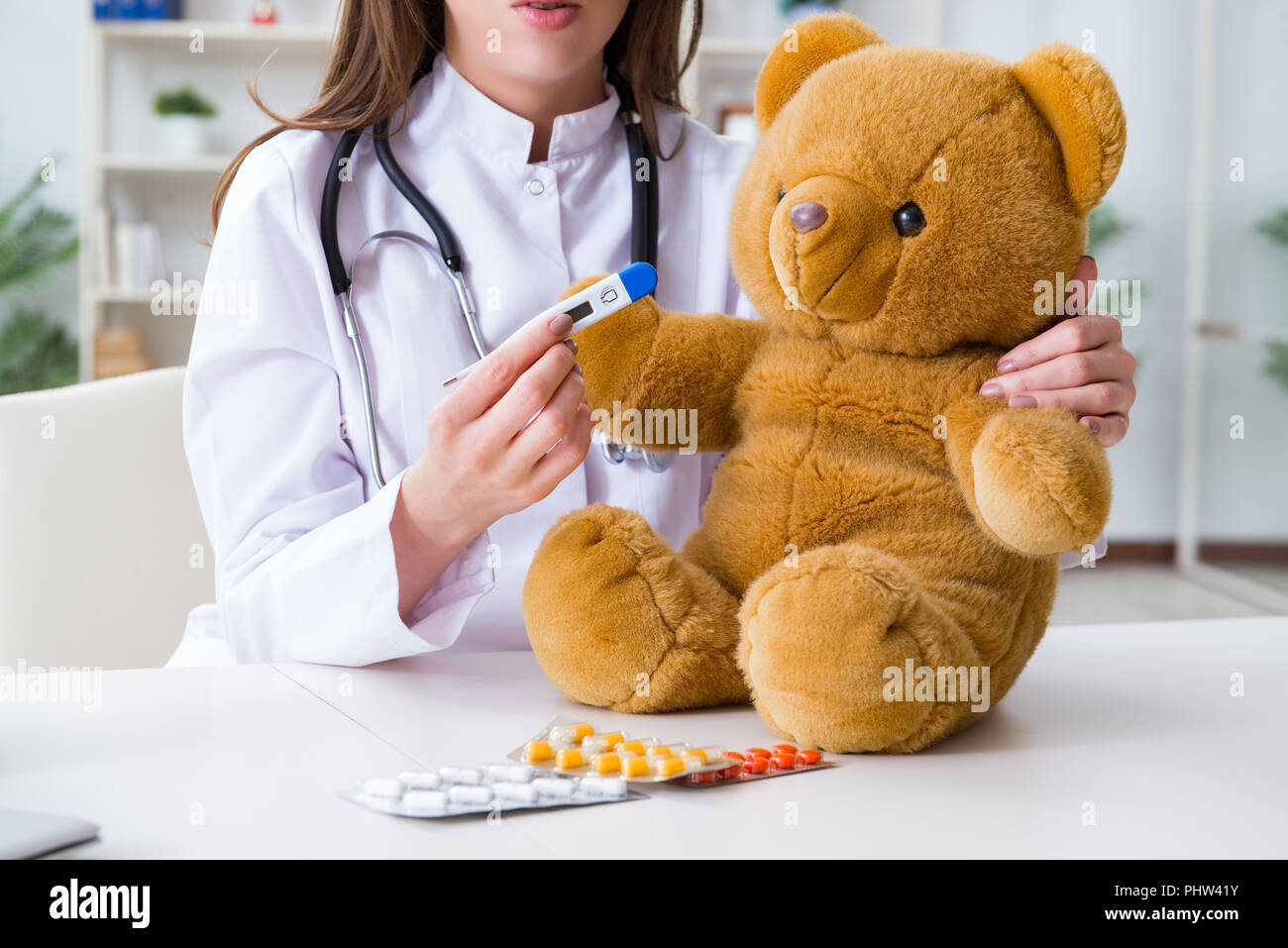 Child checking soft toy health Stock Photo - Alamy