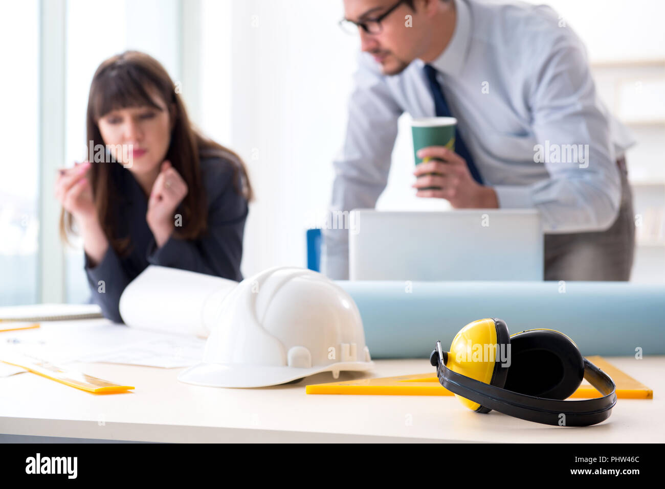 Engineers studying blueprint table hi-res stock photography and images ...