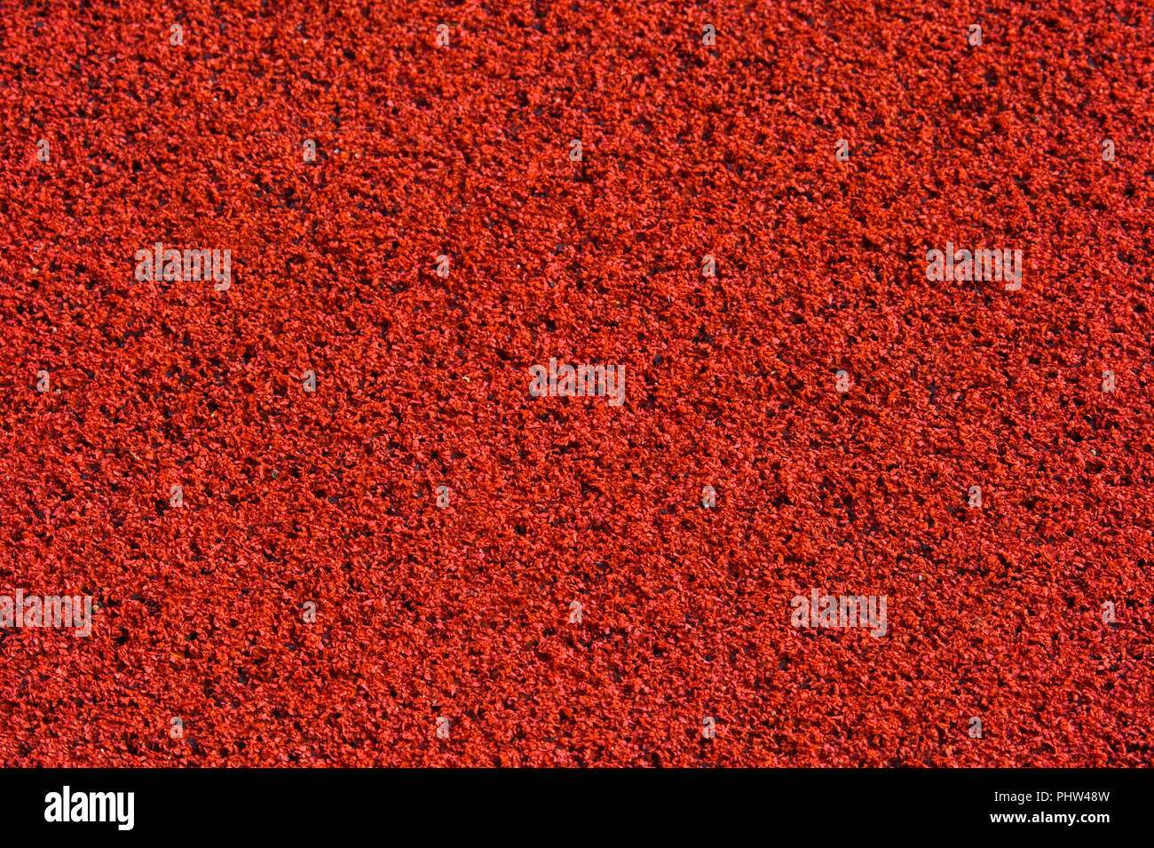 Running track rubber cover texture for background Stock Photo - Alamy