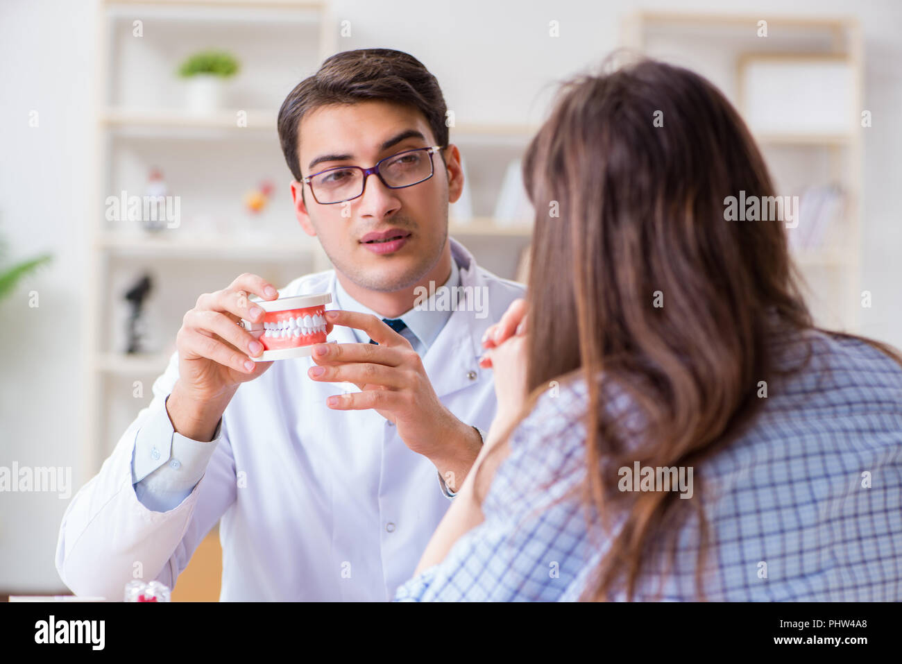 Patient visiting dentist doctor for preliminary appointment Stock Photo ...