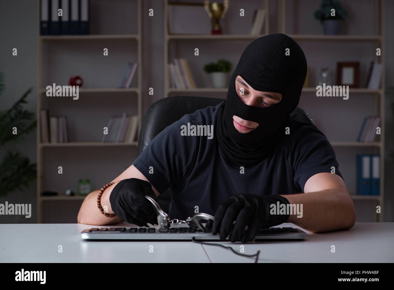 Hacker hacking computer late at night Stock Photo - Alamy