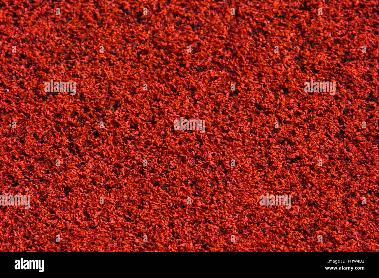 Running track rubber cover texture for background Stock Photo - Alamy
